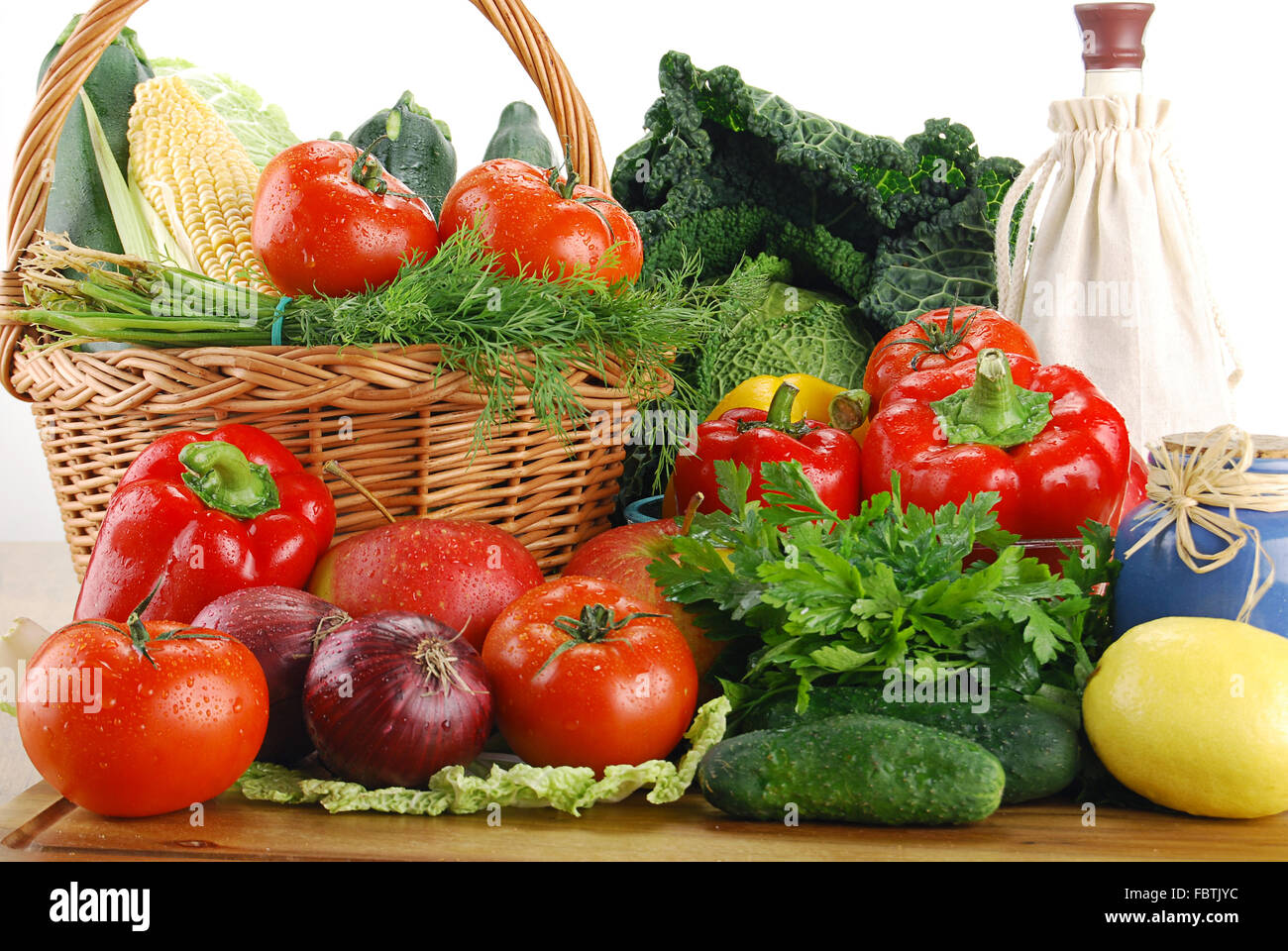 Composition with raw vegetables and wicker basket Stock Photo - Alamy