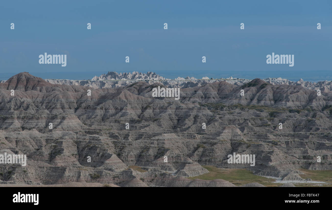 Light catches the distant rock soil geologic features at Badlands ...