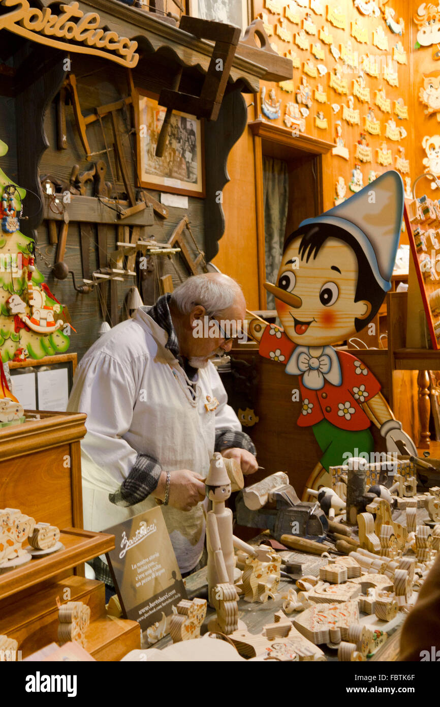 ROME, ITALY - DECEMBER 30 2014: Traditional craftsman carving wood in ...