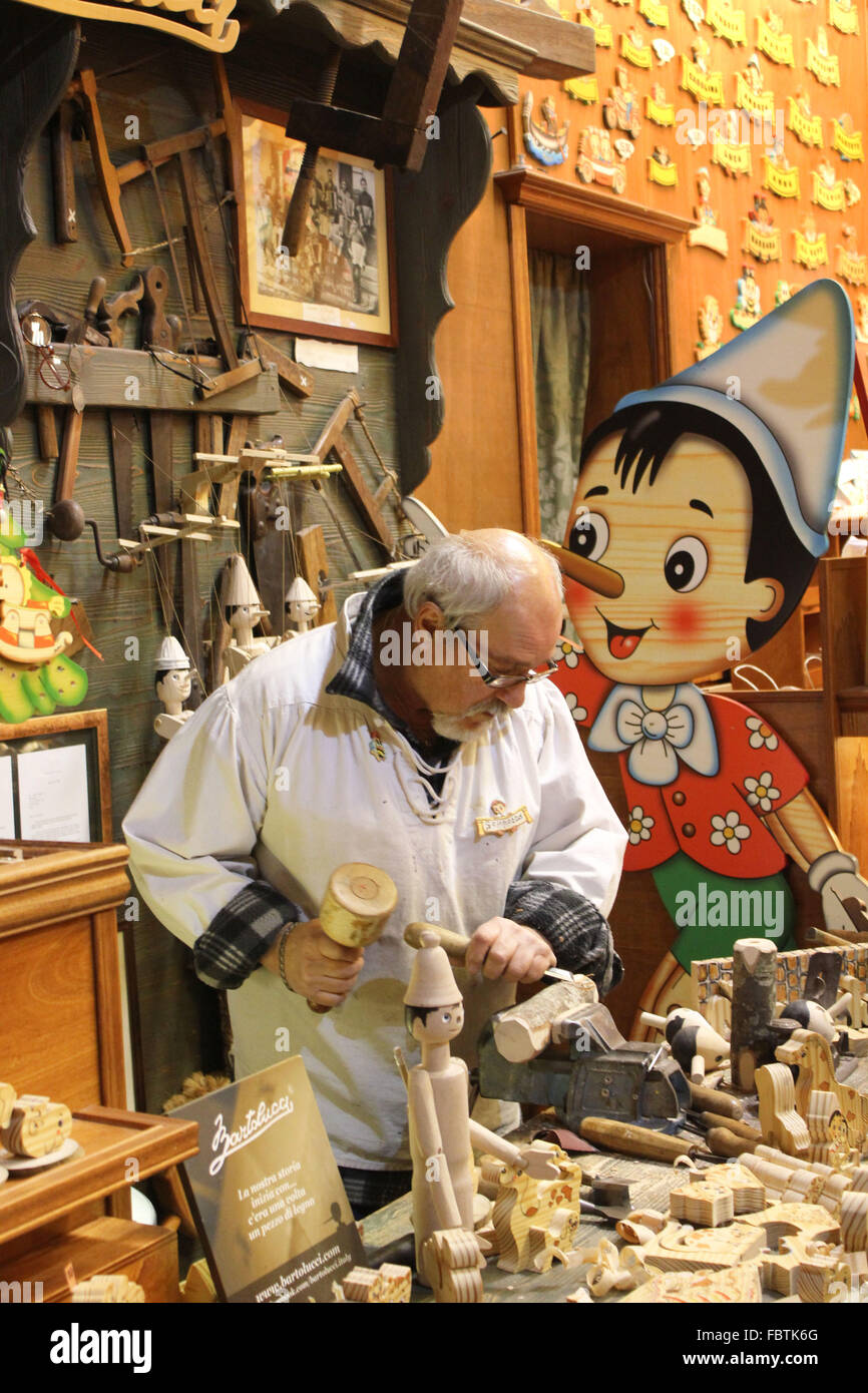 ROME, ITALY - DECEMBER 30 2014: Traditional craftsman carving wood in ...