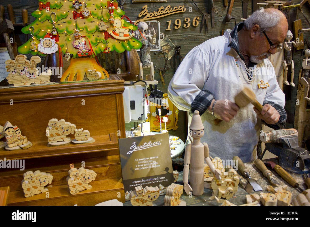 ROME, ITALY - DECEMBER 30 2014: Traditional craftsman carving wood in ...