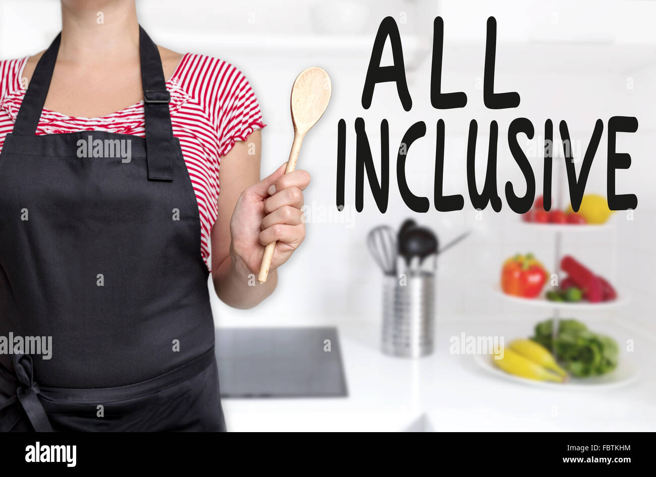 all inclusive cook holding wooden spoon concept Stock Photo - Alamy