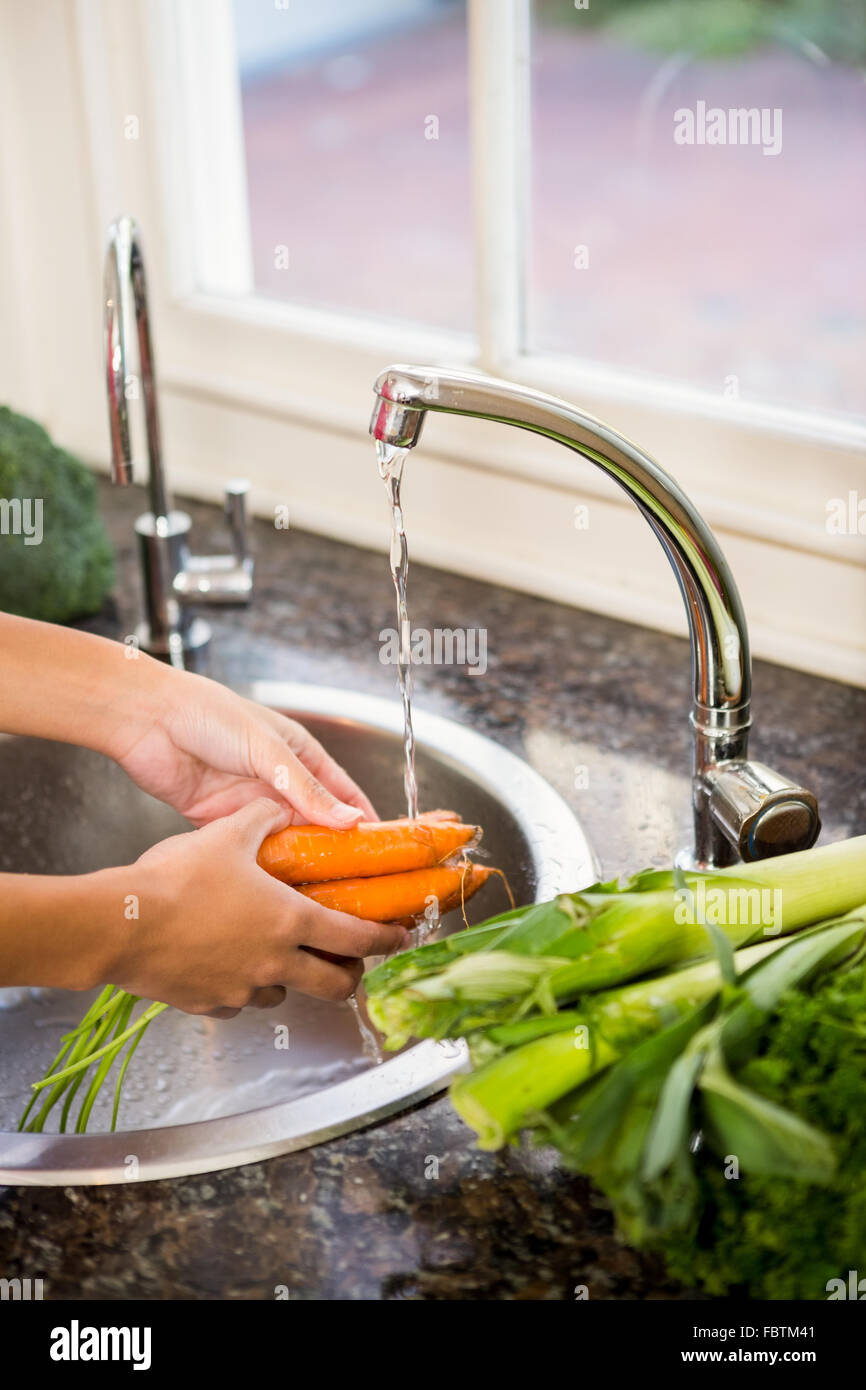 Washing carrots hi-res stock photography and images - Alamy