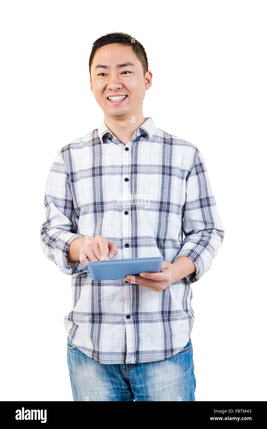 Happy man using tablet computer Stock Photo - Alamy