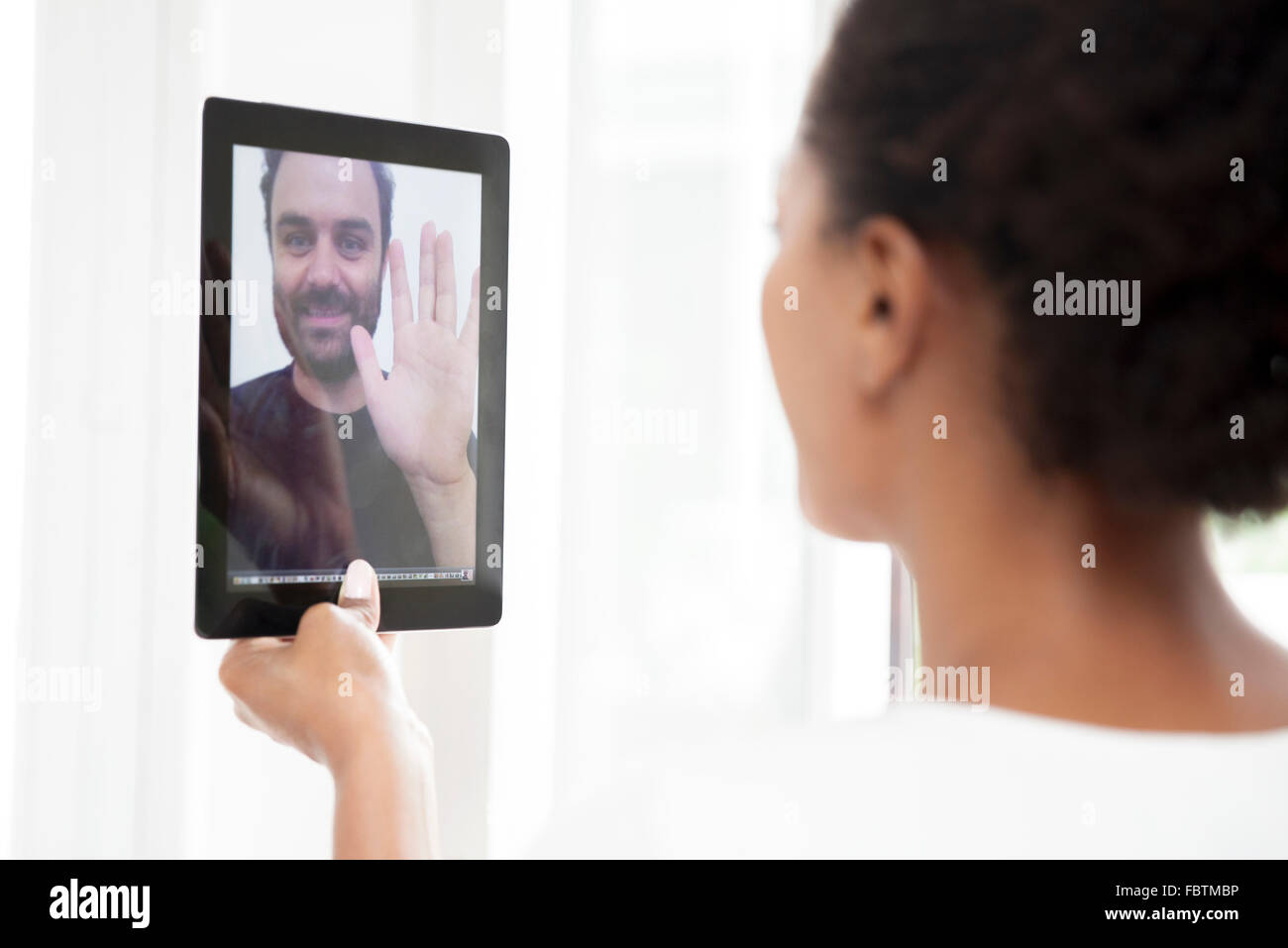 Couple doing video chat Stock Photo - Alamy