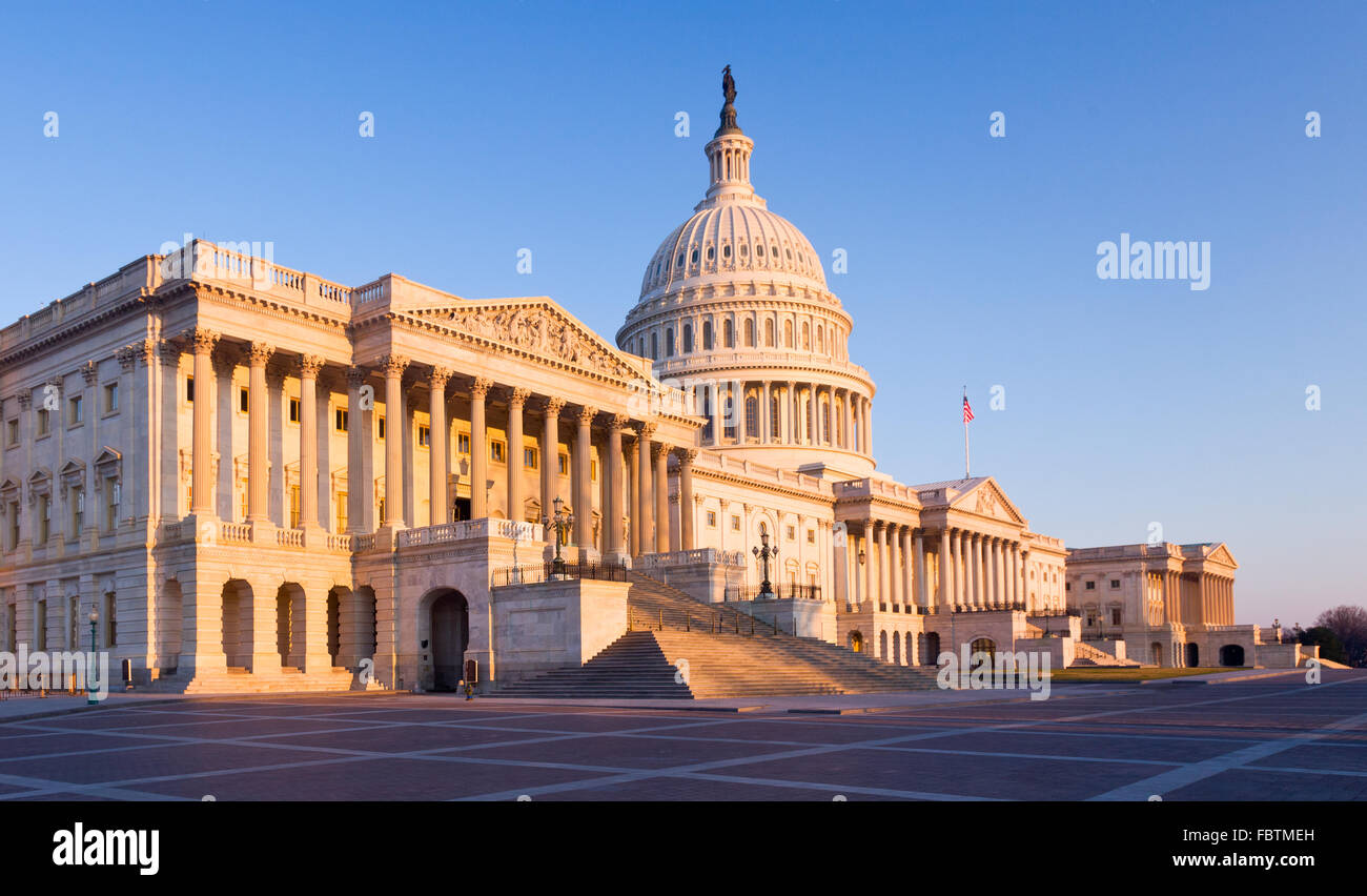 Rising sun illuminates the front of the Capitol building in DC Stock ...