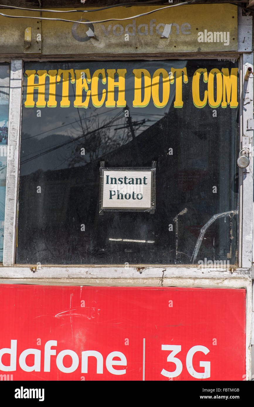 Shabby looking derelict and damaged shop front proclaiming its HITECH ...