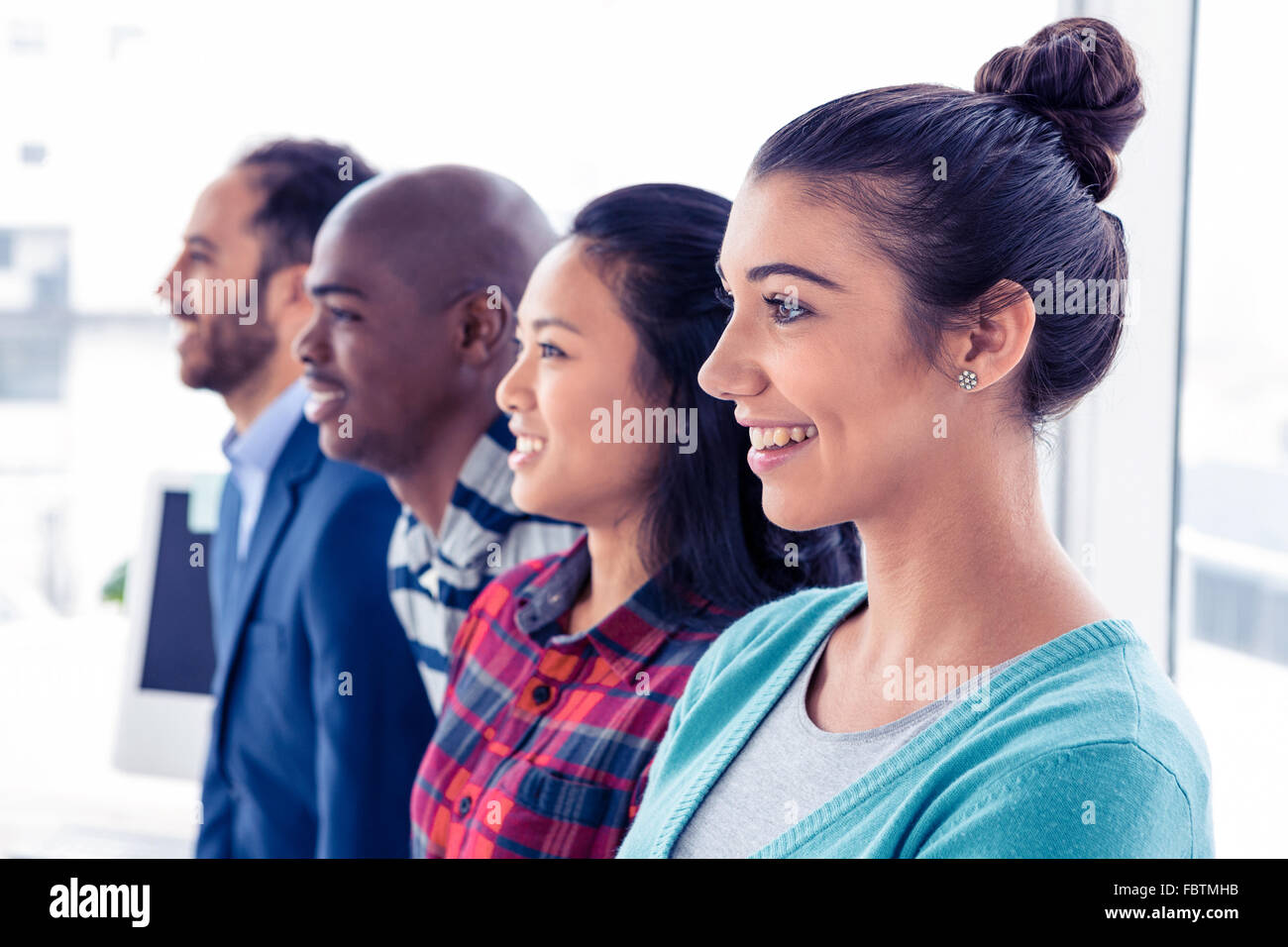Side view of business people in creative office Stock Photo - Alamy