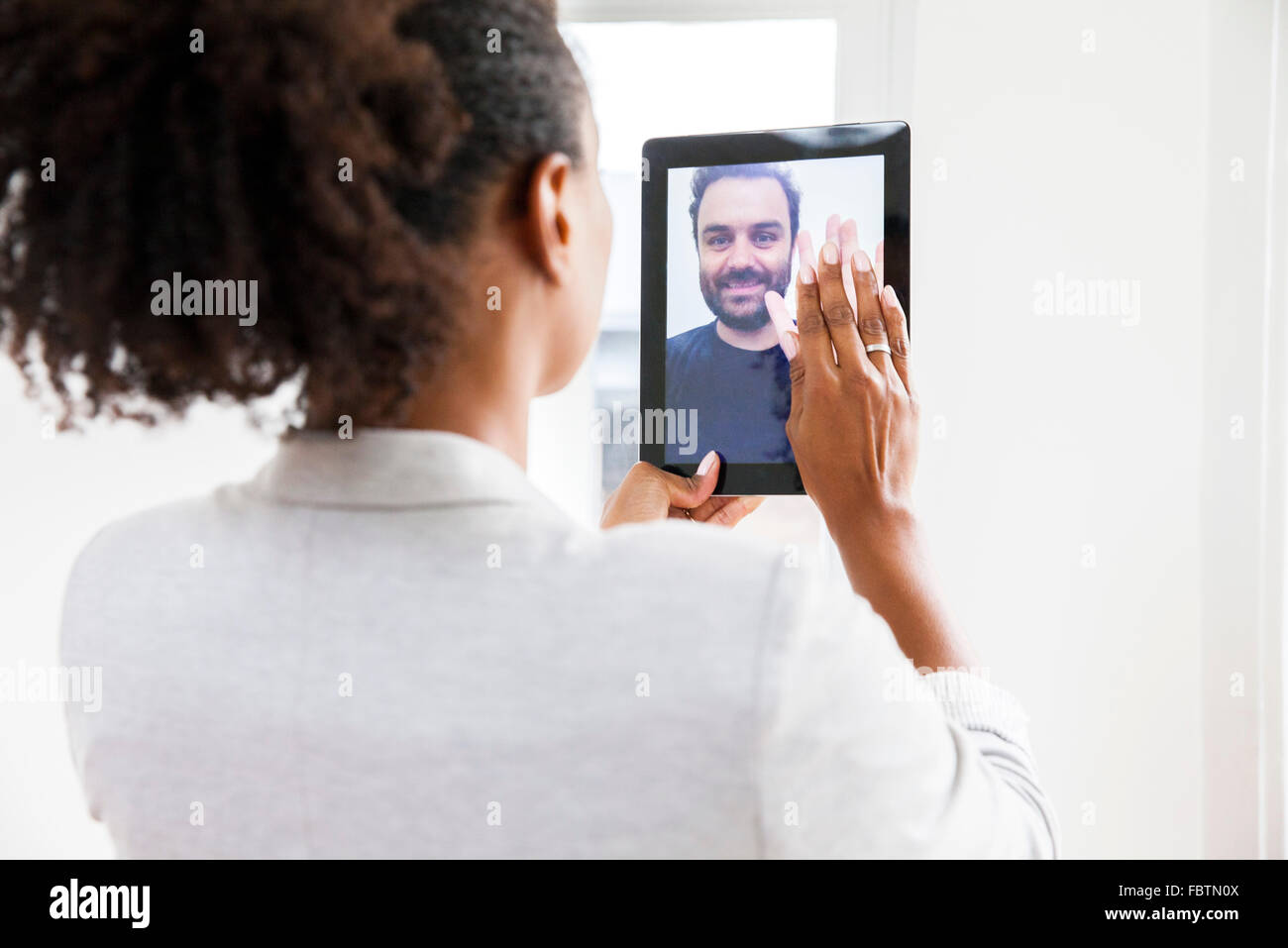 Couple doing video chat Stock Photo - Alamy