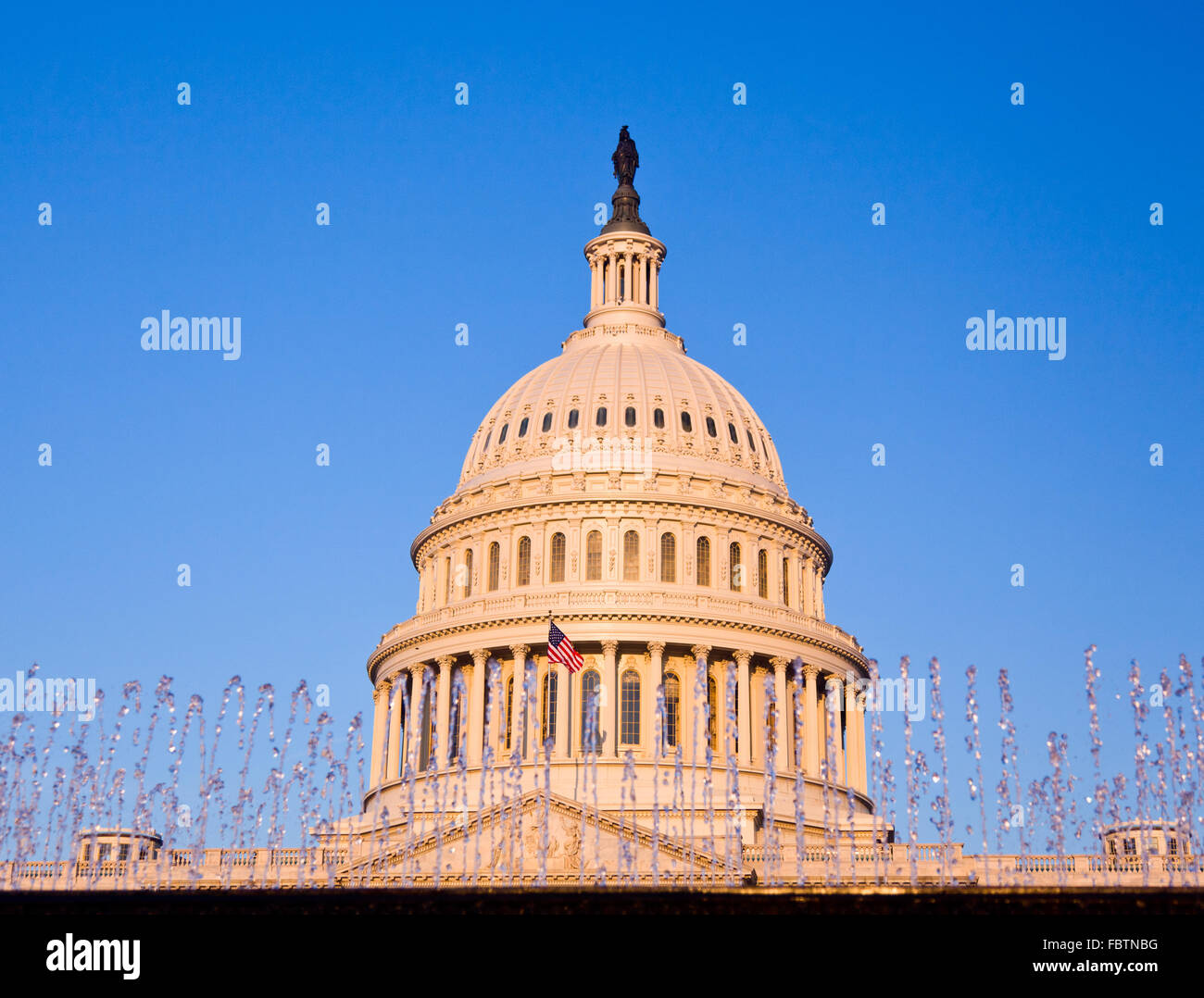 Rising sun illuminates the front of the Capitol building in DC Stock ...