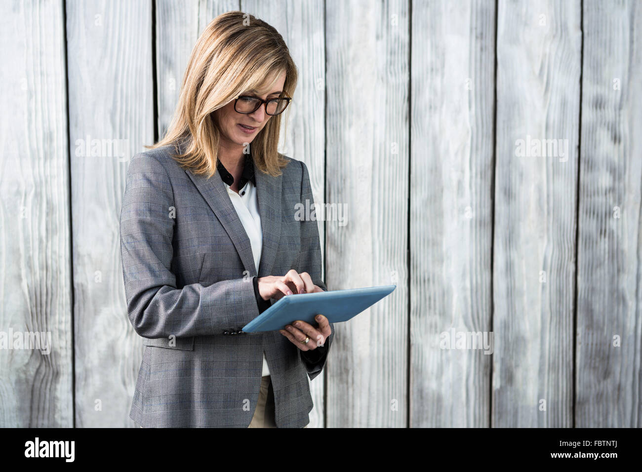 Woman using her tablet Stock Photo - Alamy