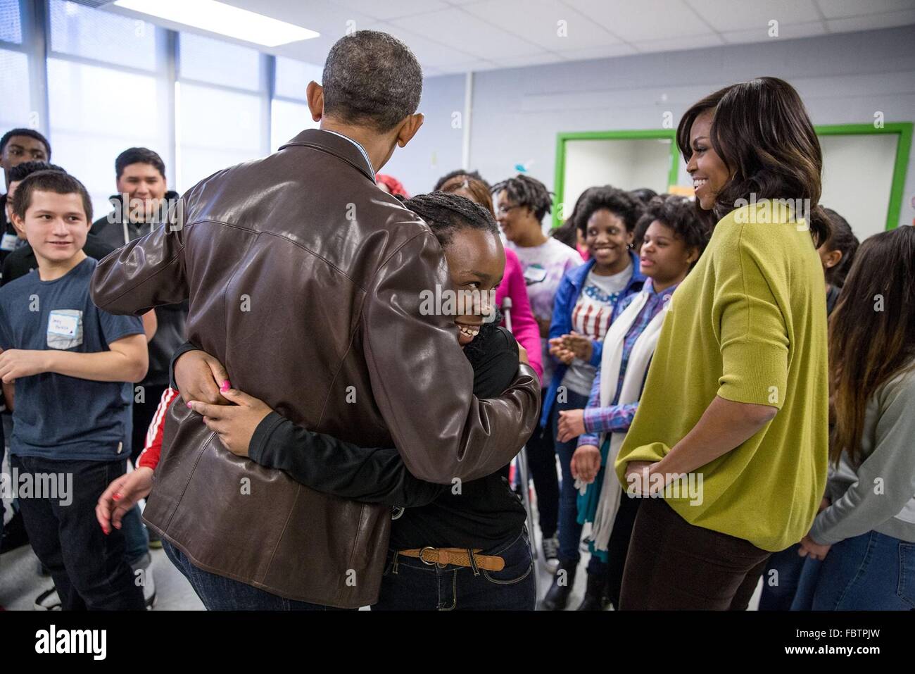 U.S President Barack Obama gets a hug as First Lady Michelle Obama ...