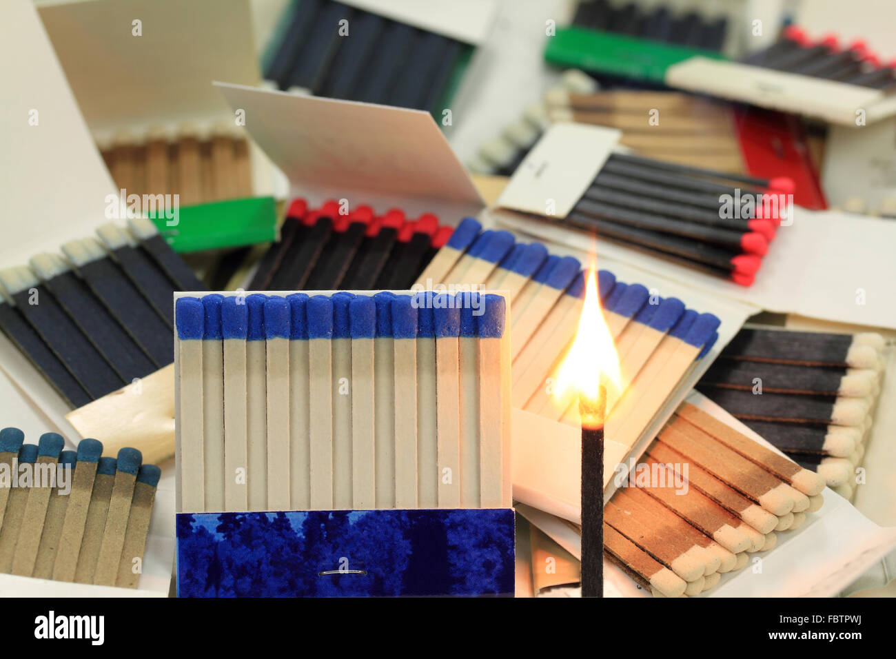 Matchbooks and fired Paper Stick with flame Stock Photo - Alamy