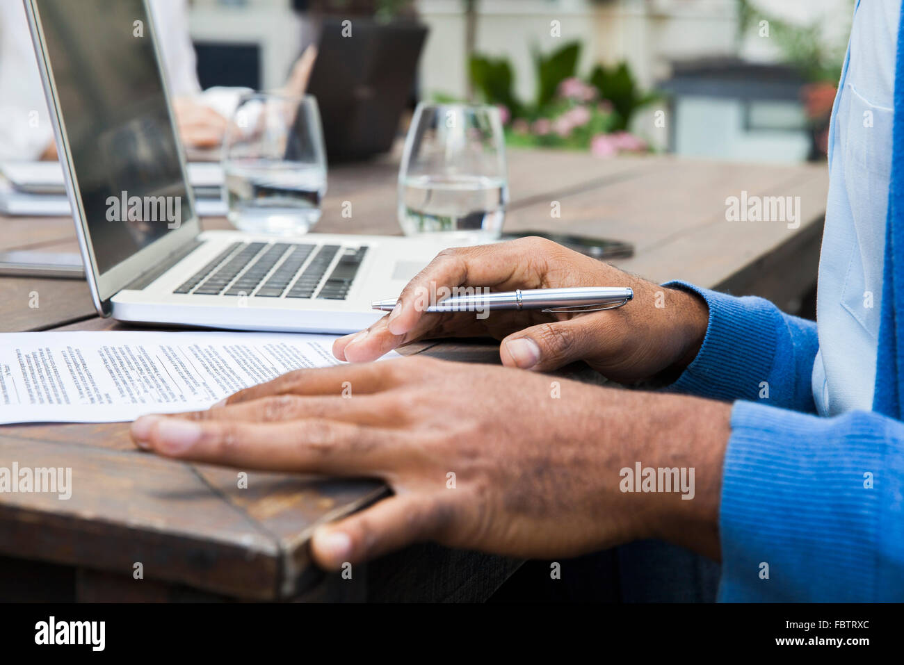 Man reviewing document Stock Photo - Alamy