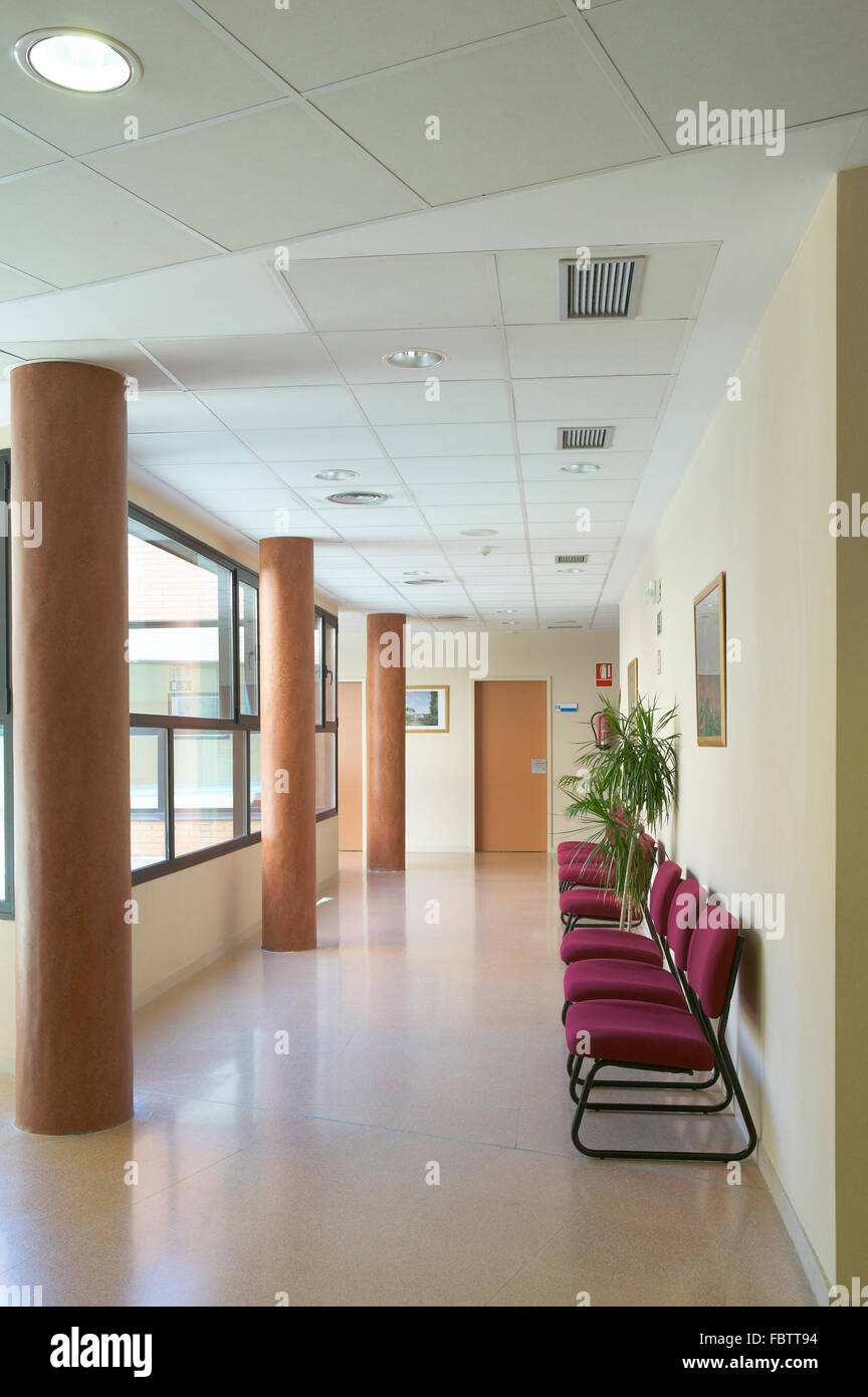 Hospital corridor with private medical offices. Vertical Stock Photo ...