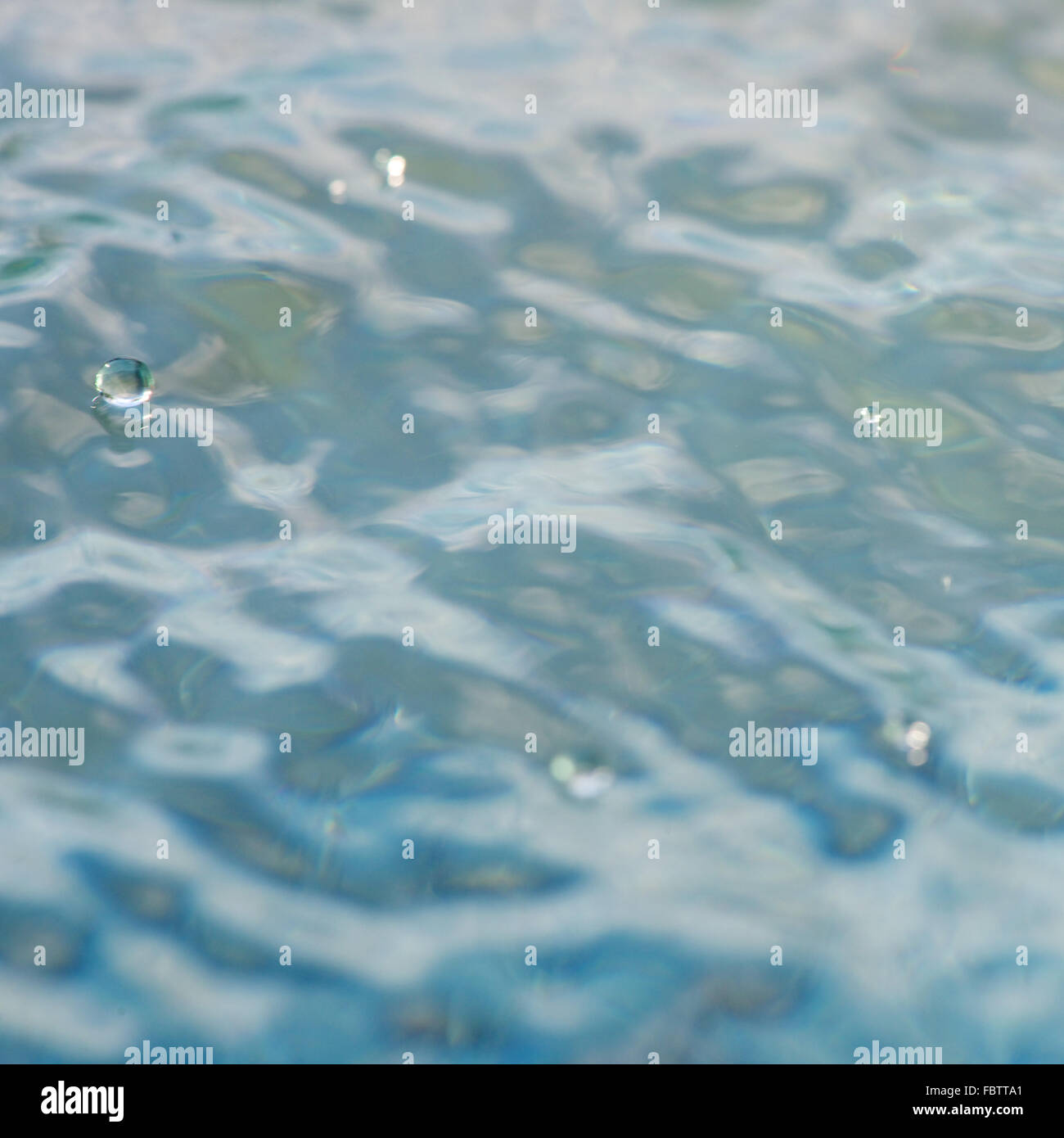 Droplets on water surface Stock Photo - Alamy