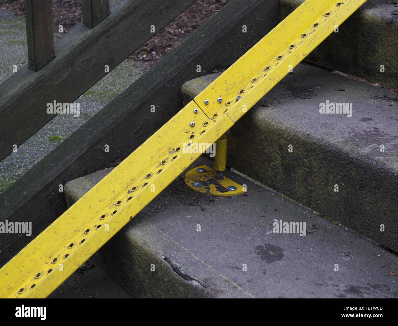 Cycle wheel ramp on canal bridge steps, Boston Manor Park footbridge ...