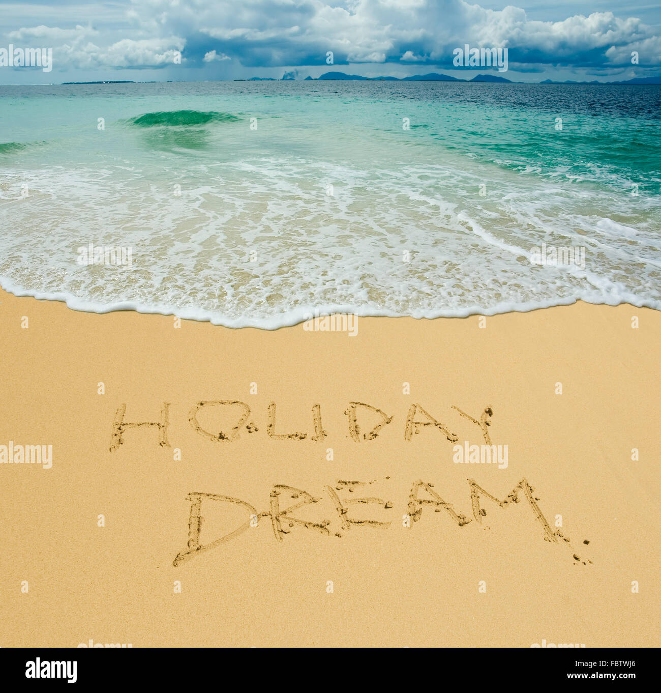 holiday dream written in a sandy tropical beach Stock Photo - Alamy
