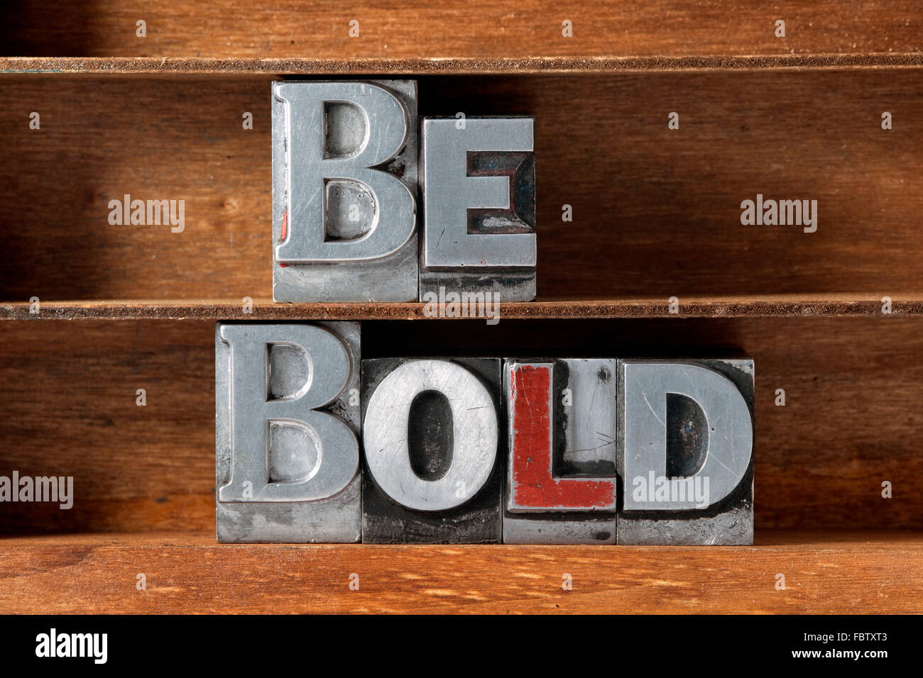 be bold phrase made from metallic letterpress type on wooden tray Stock ...