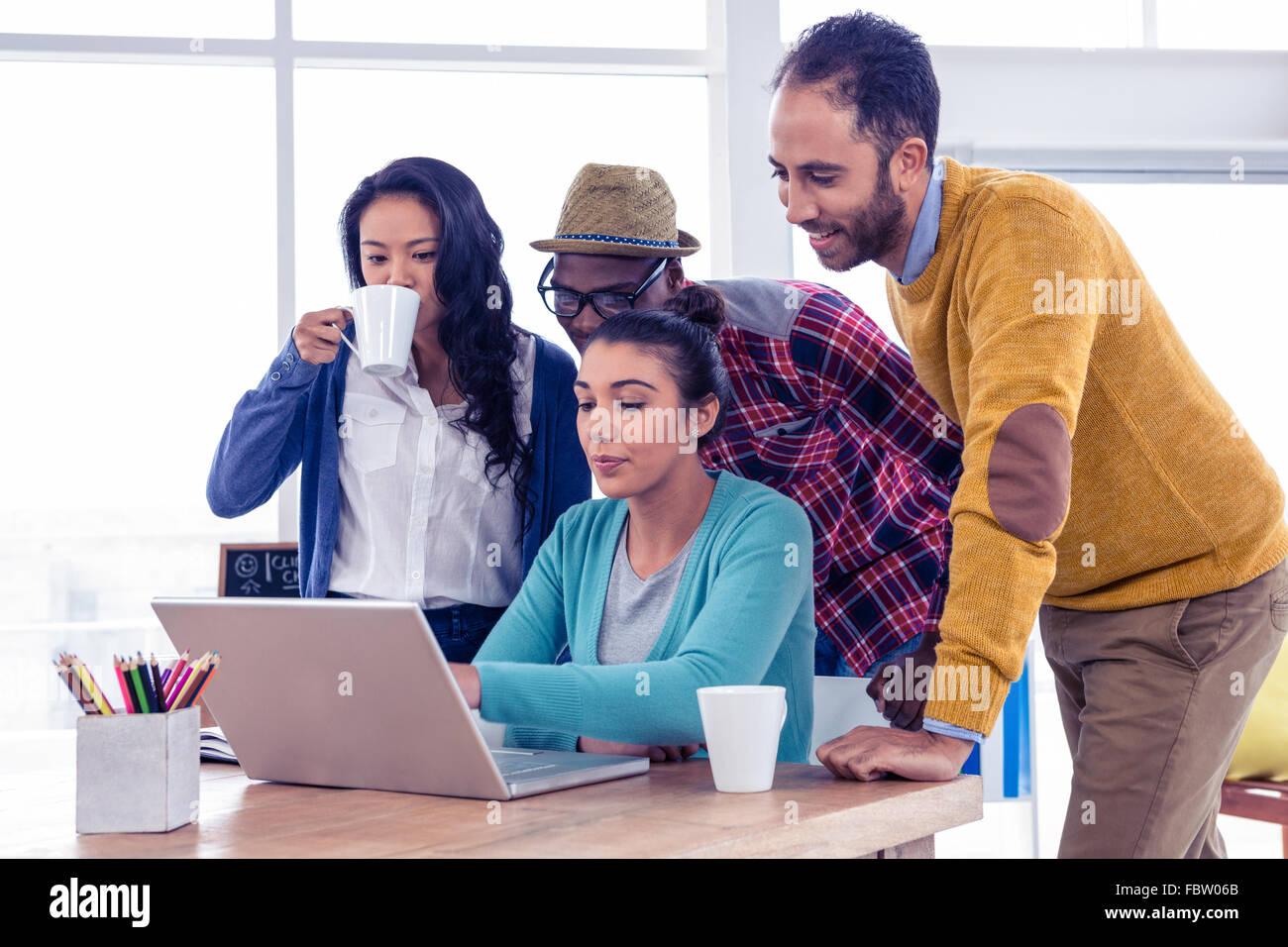 Business people using laptop in meeting Stock Photo - Alamy