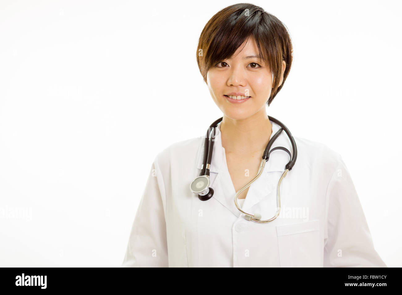 Chinese female doctor with stethoscope smiling at camera Stock Photo ...