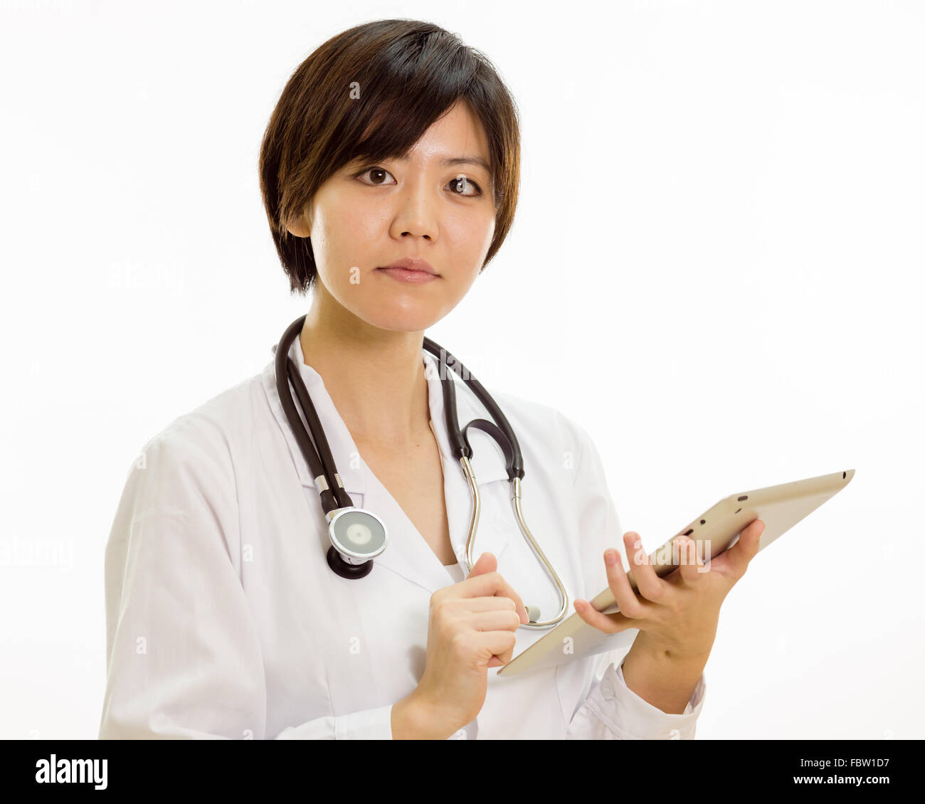 Chinese female doctor with tablet computer, looking at camera Stock ...