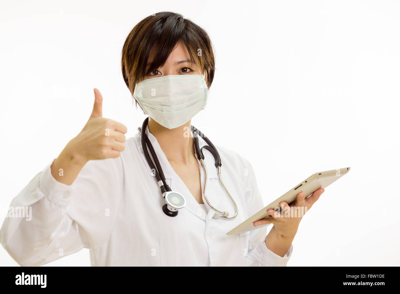 Chinese female doctor with tablet computer showing thumbs-up Stock ...
