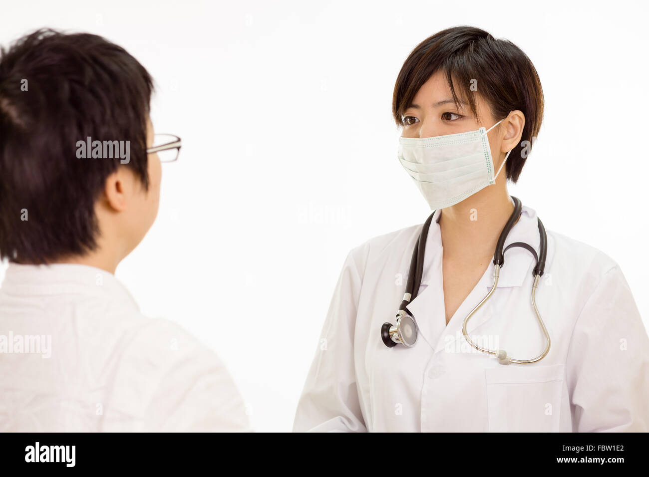 Chinese female doctor with patient Stock Photo - Alamy