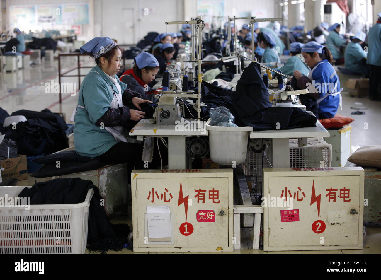 Female labours works at a cloth factory in Huaibei city, Anhui province ...