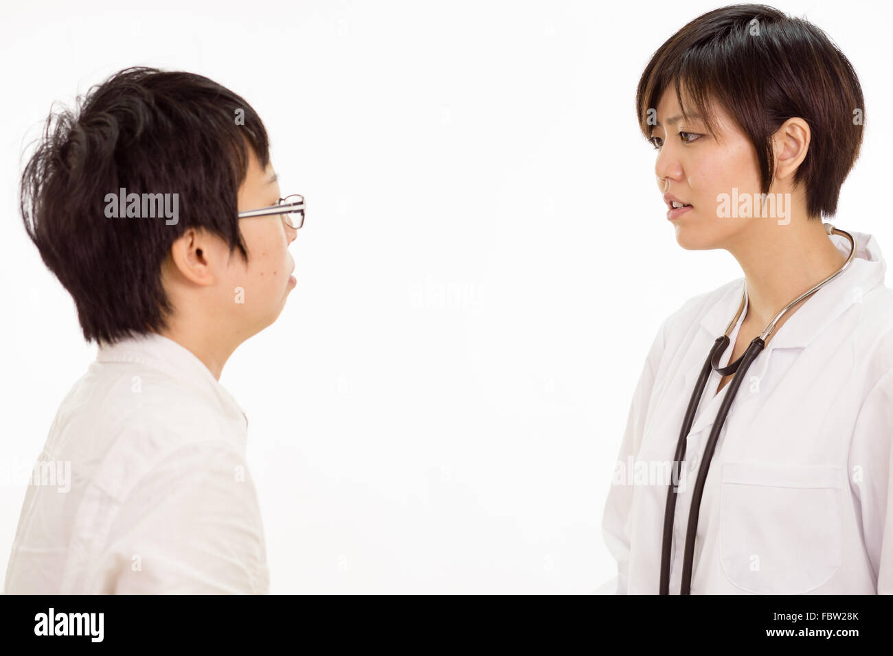 Chinese female doctor talking to patient Stock Photo - Alamy