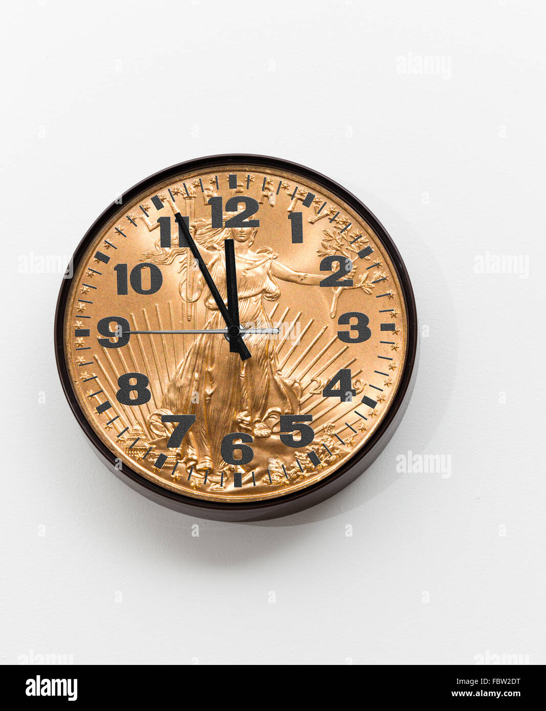 Office clock with gold coin as face for concept Stock Photo - Alamy