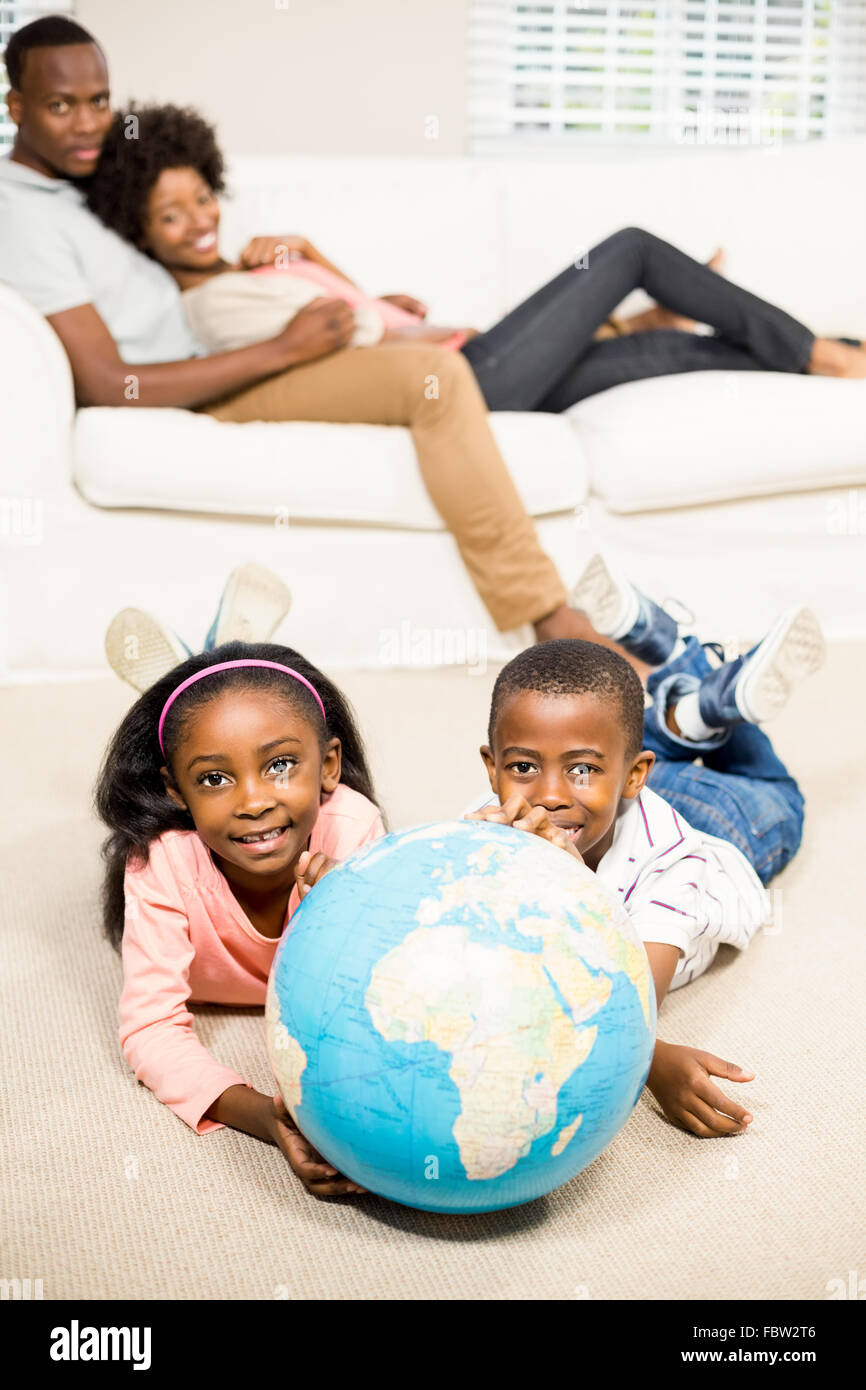 Close up of kids using a world globe Stock Photo - Alamy