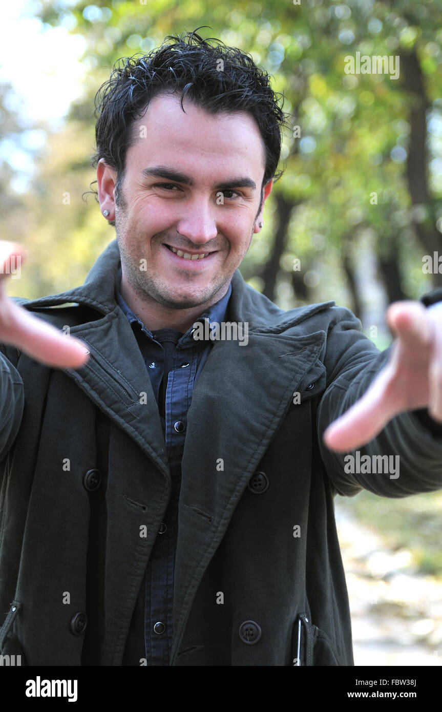 Handsome young man expressing his inner feelings Stock Photo - Alamy