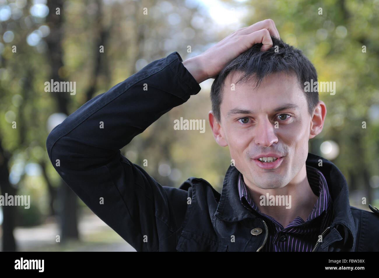 Handsome young man expressing his inner feelings Stock Photo - Alamy