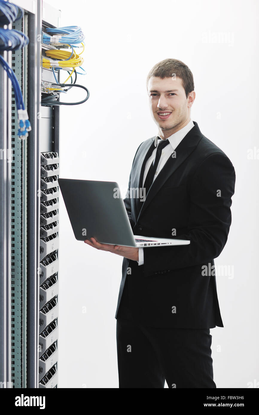 businessman with laptop in network server room Stock Photo - Alamy
