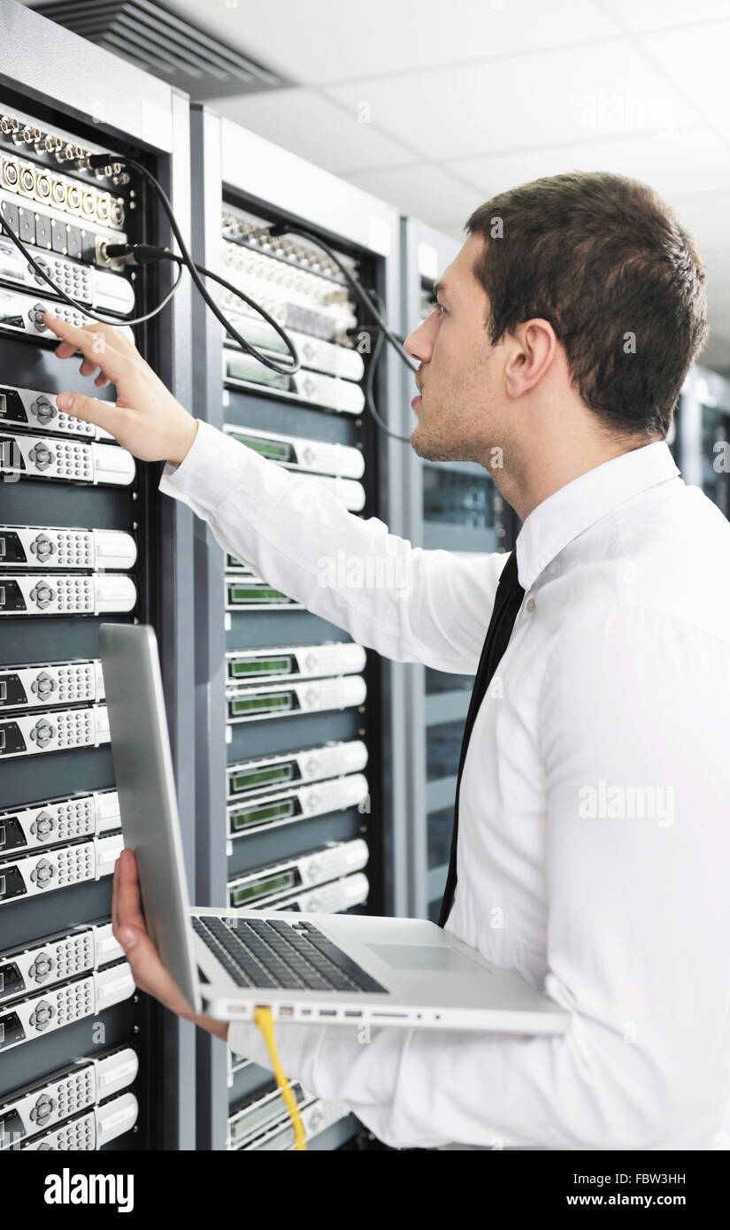 businessman with laptop in network server room Stock Photo - Alamy