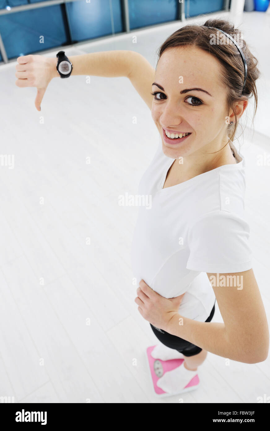 happy diet concept with young woman on pink scale Stock Photo - Alamy
