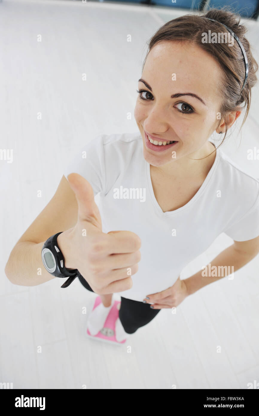 happy diet concept with young woman on pink scale Stock Photo - Alamy