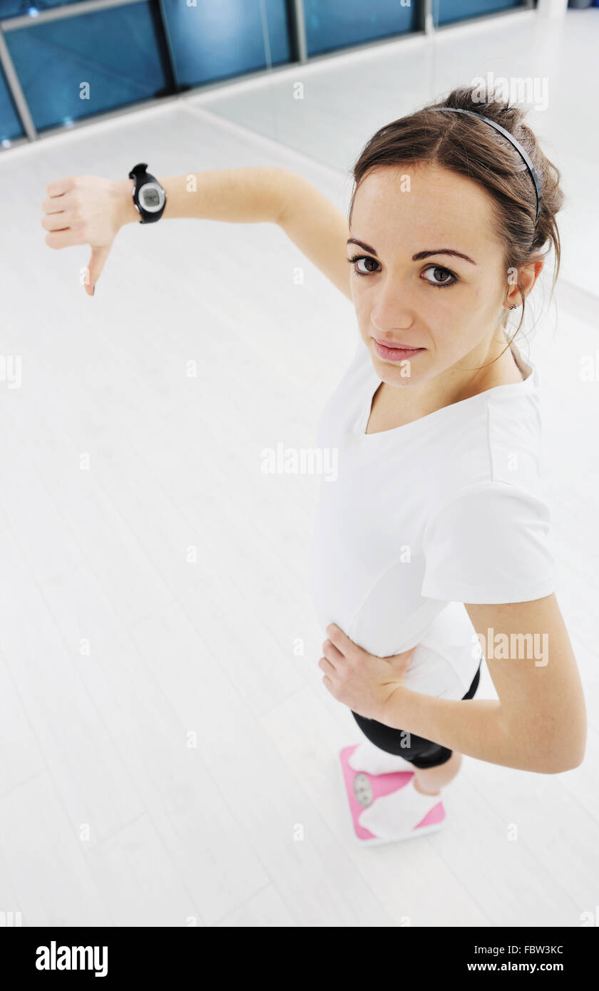 happy diet concept with young woman on pink scale Stock Photo - Alamy