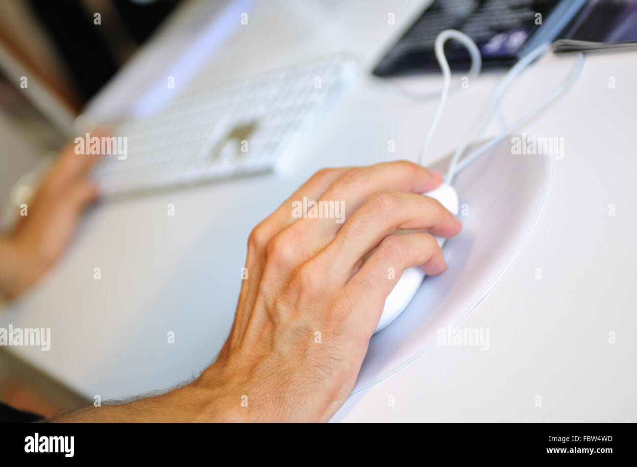 lose-up of male hand on mouse while working on laptop Stock Photo - Alamy