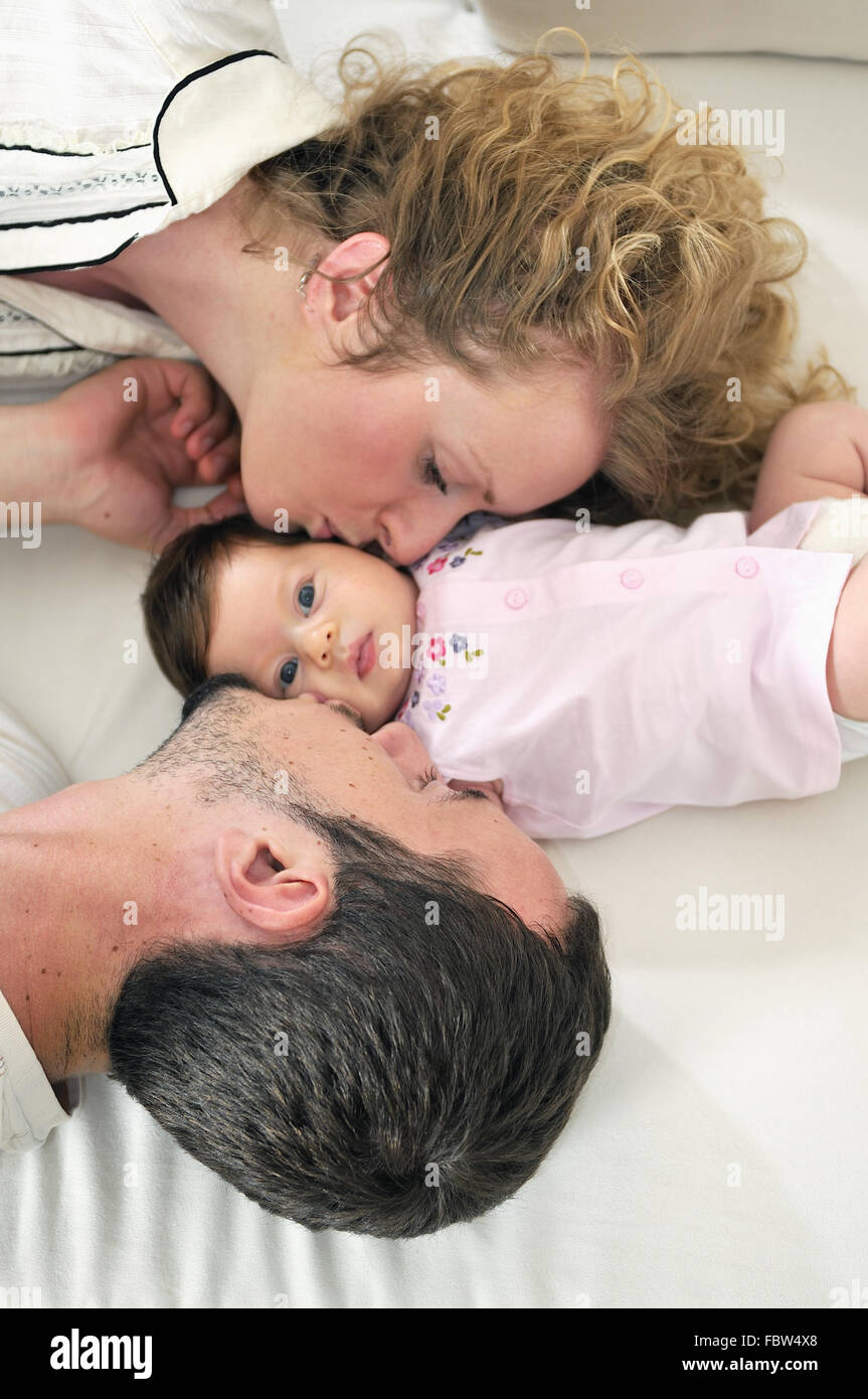 indoor portrait with happy young family and cute little babby Stock ...