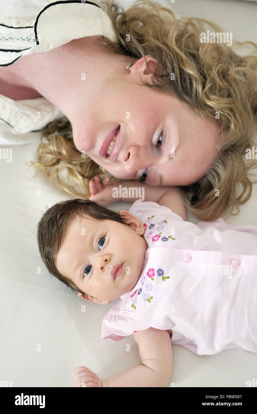 beautiful young mother small with little baby Stock Photo - Alamy