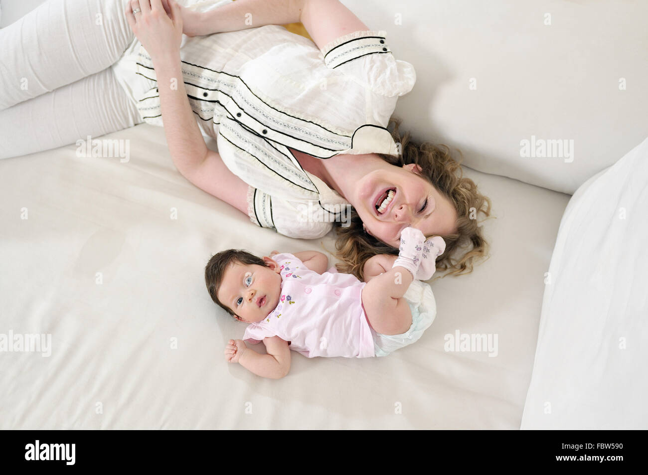 beautiful young mother small with little baby Stock Photo - Alamy