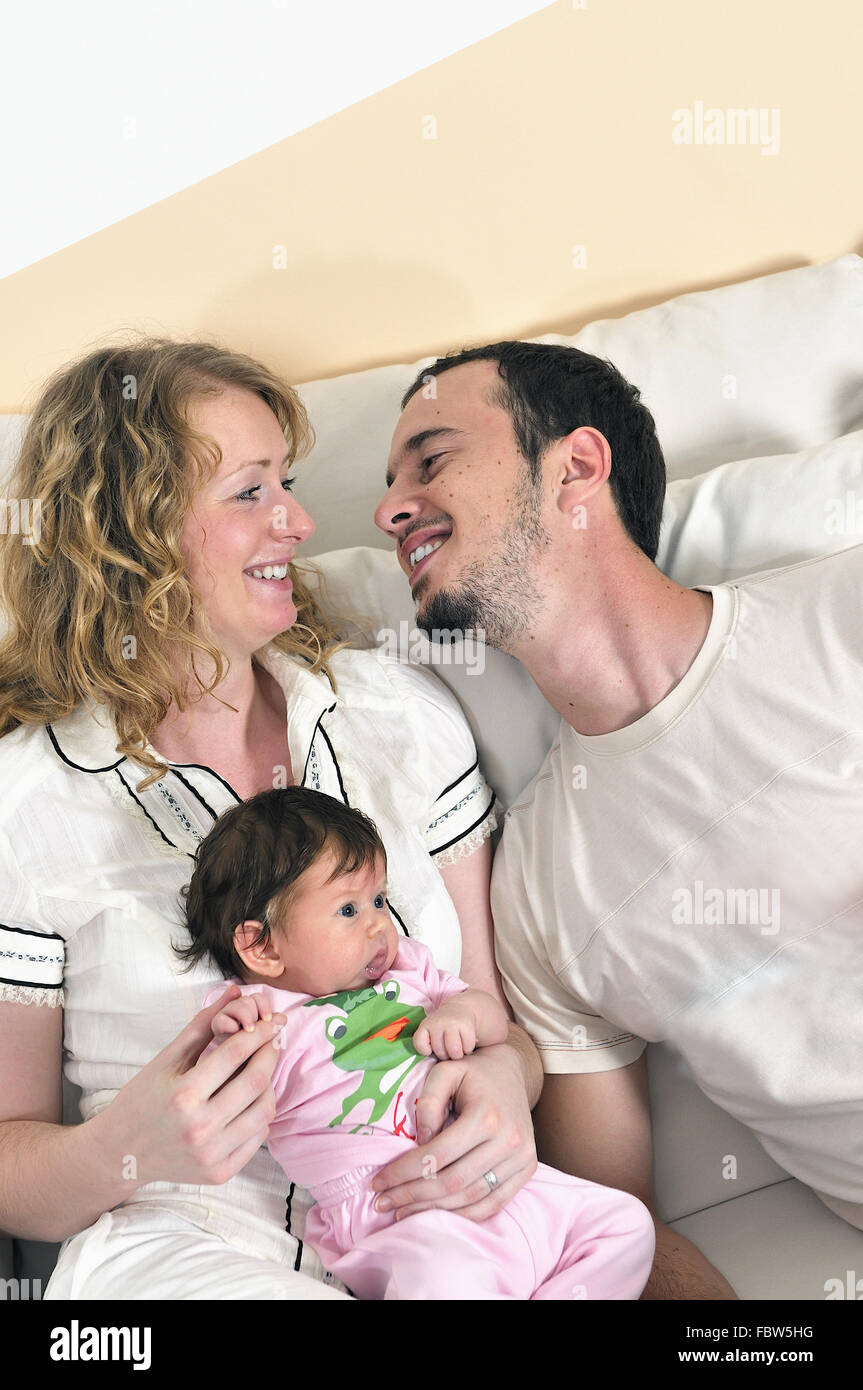 indoor portrait with happy young family and cute little babby Stock ...