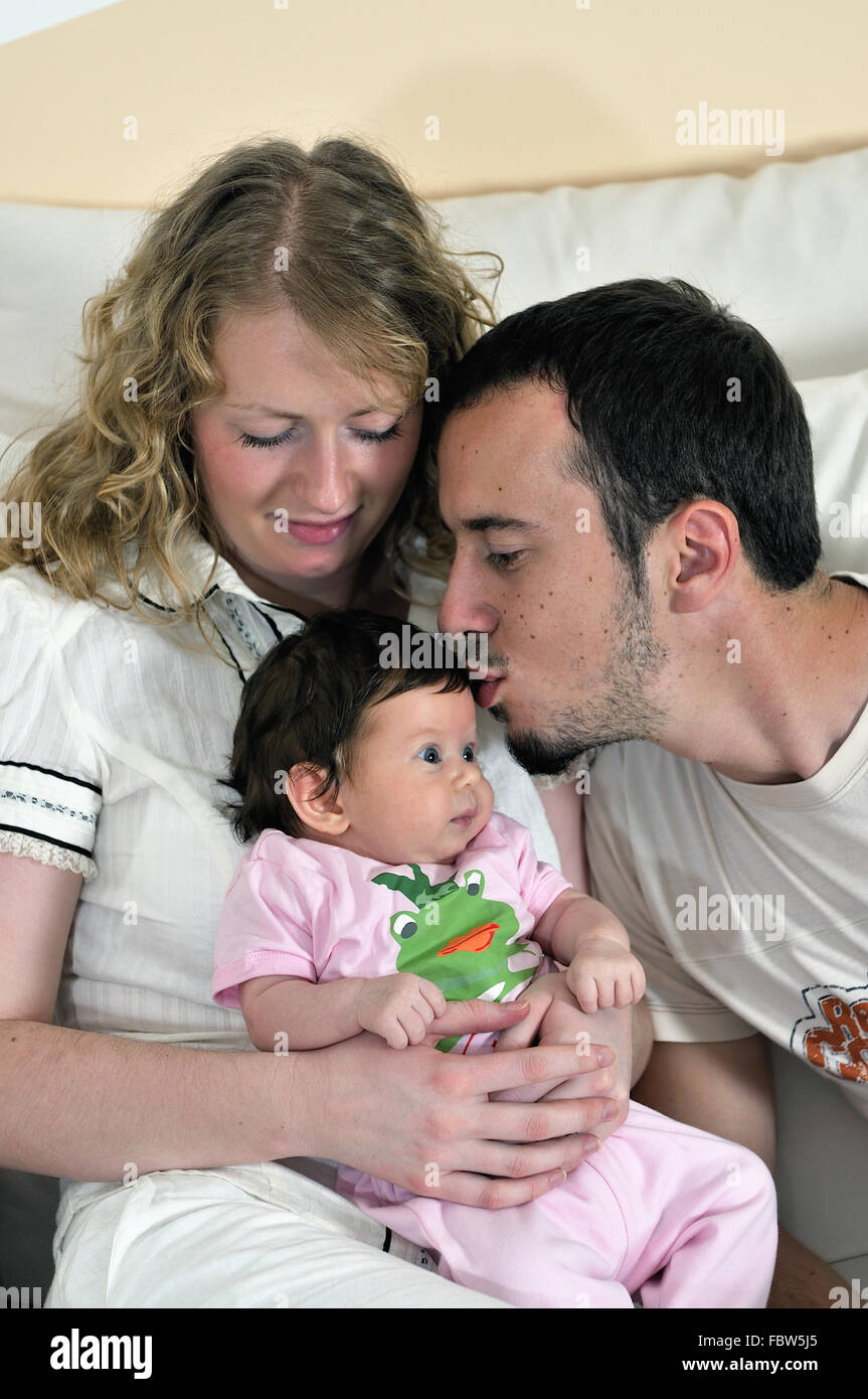 indoor portrait with happy young family and cute little babby Stock ...