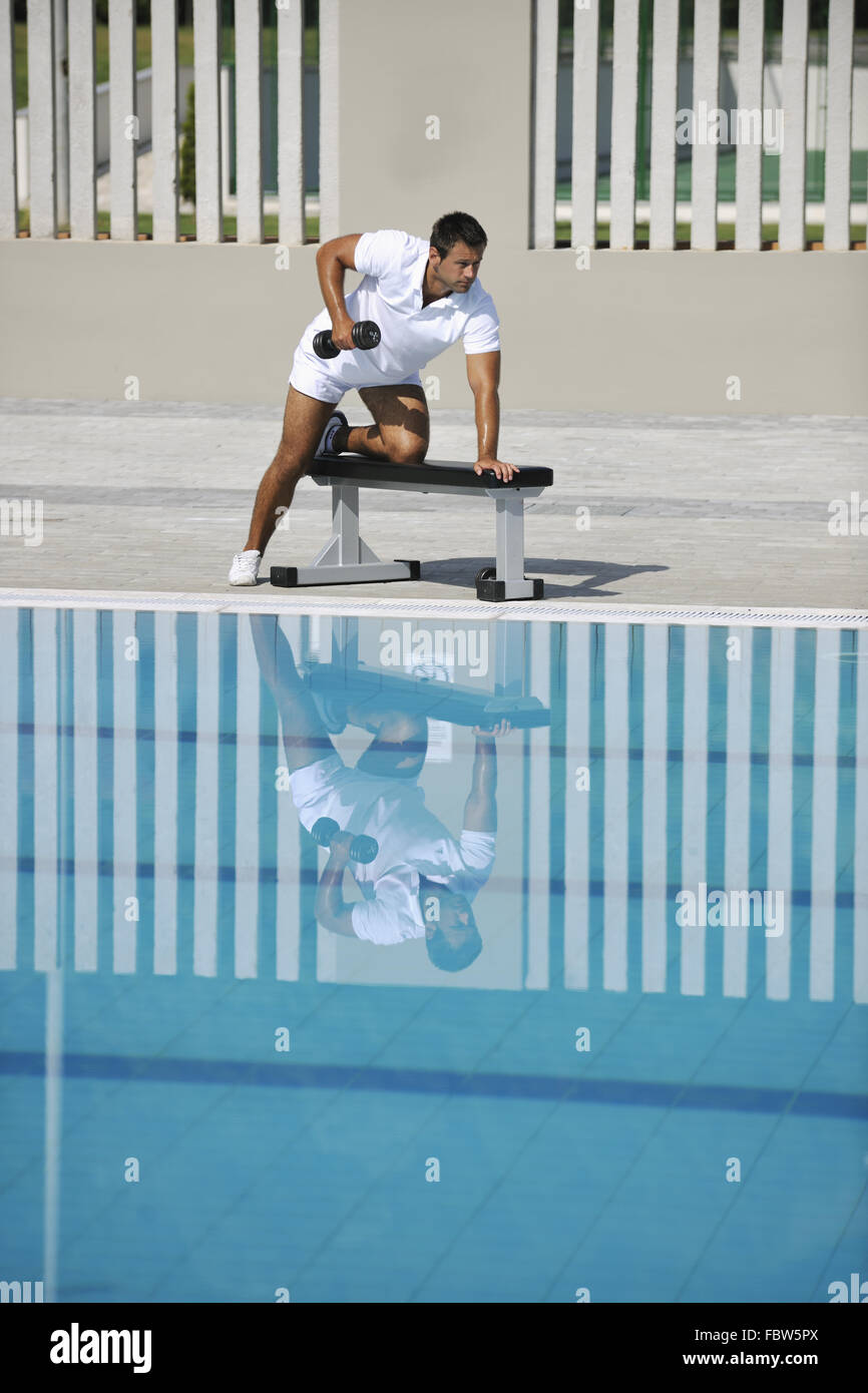 young healthy athlete man exercise at poolside Stock Photo - Alamy