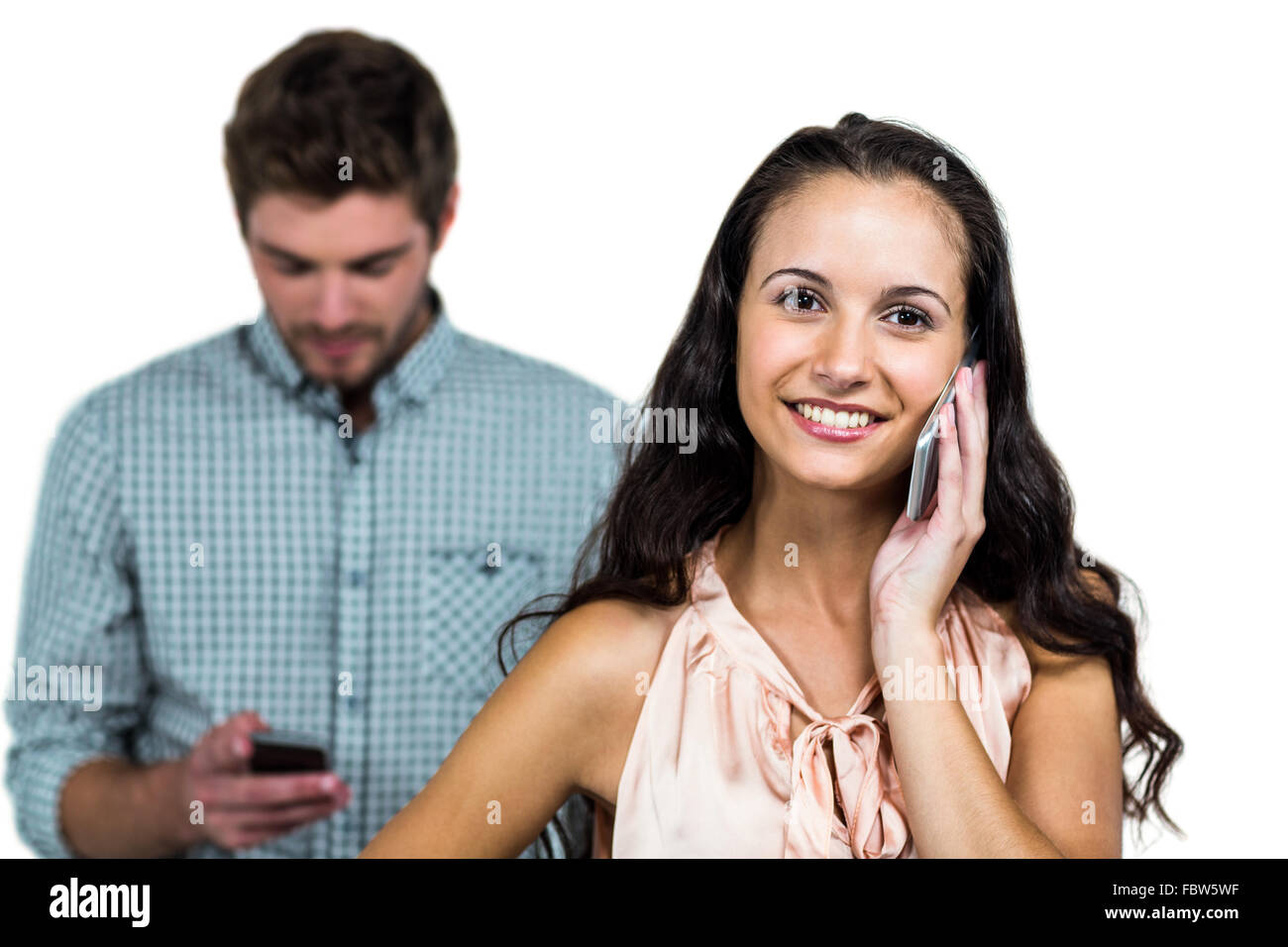 Happy couple using smartphones Stock Photo - Alamy