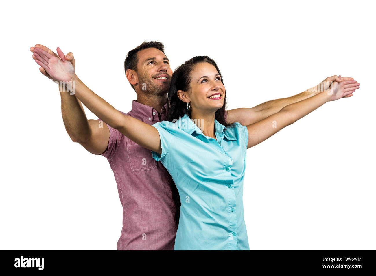 Cheerful couple with arms outstretched Stock Photo - Alamy