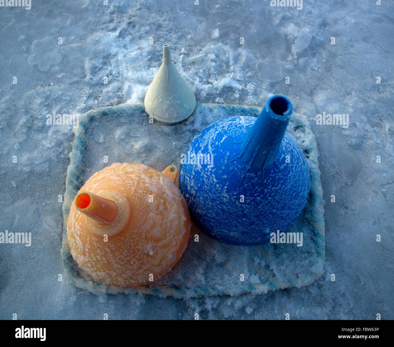Three frozen plastic funnels Stock Photo - Alamy