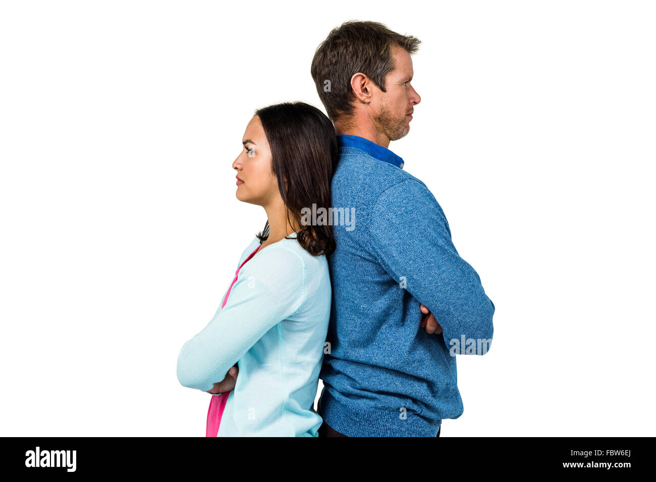 Angry couple standing back to back Stock Photo - Alamy